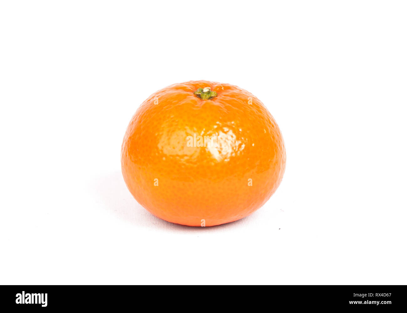 Single small orange isolated on white background Stock Photo - Alamy