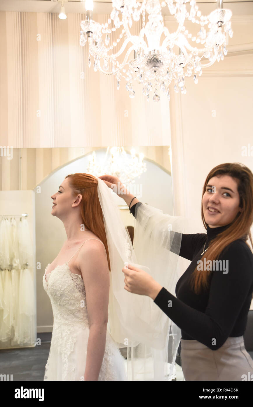 Wedding dress shop assistant hi-res stock photography and images - Alamy