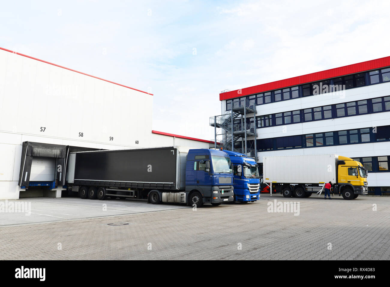 trucks are loaded with goods at the depot in a shipping company Stock ...