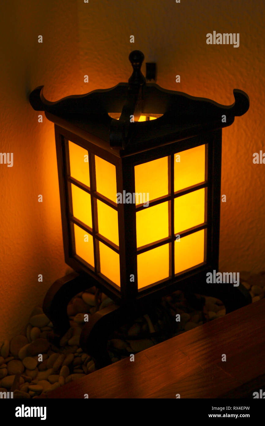 Decorative lantern in a Japanese style in a corner near the table Stock ...