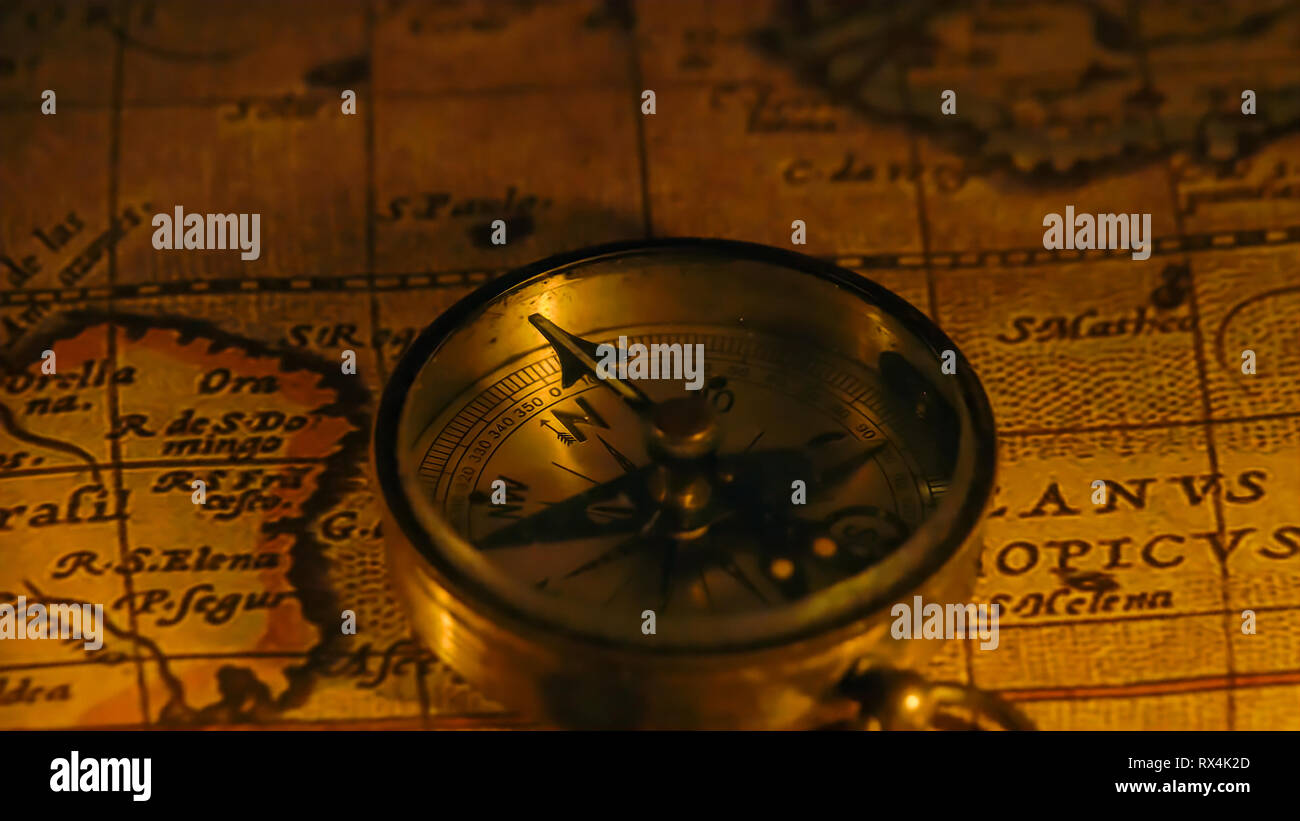 Zoom out view of the compass on a map where there are two candle to ...