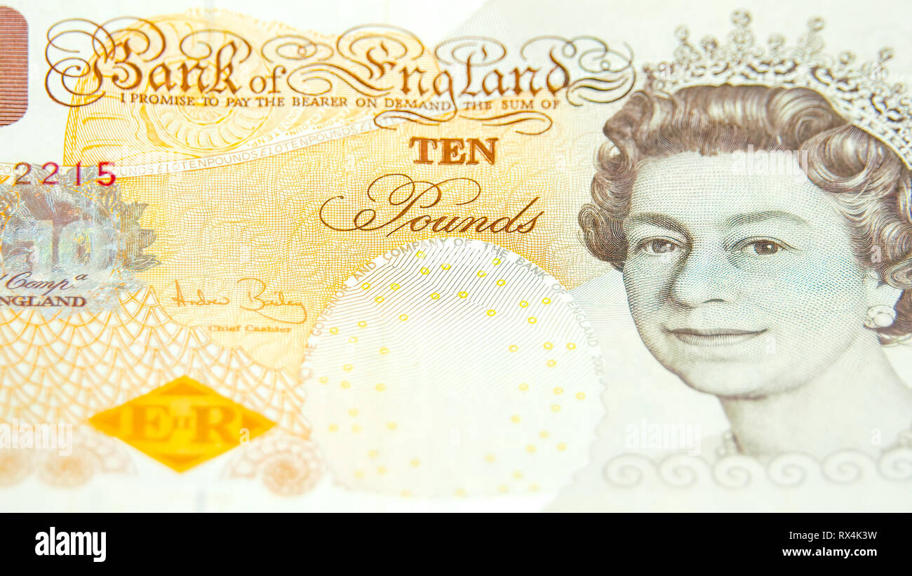 Zoom out capture of the 10 Pounds bill from England. On the bill is the ...