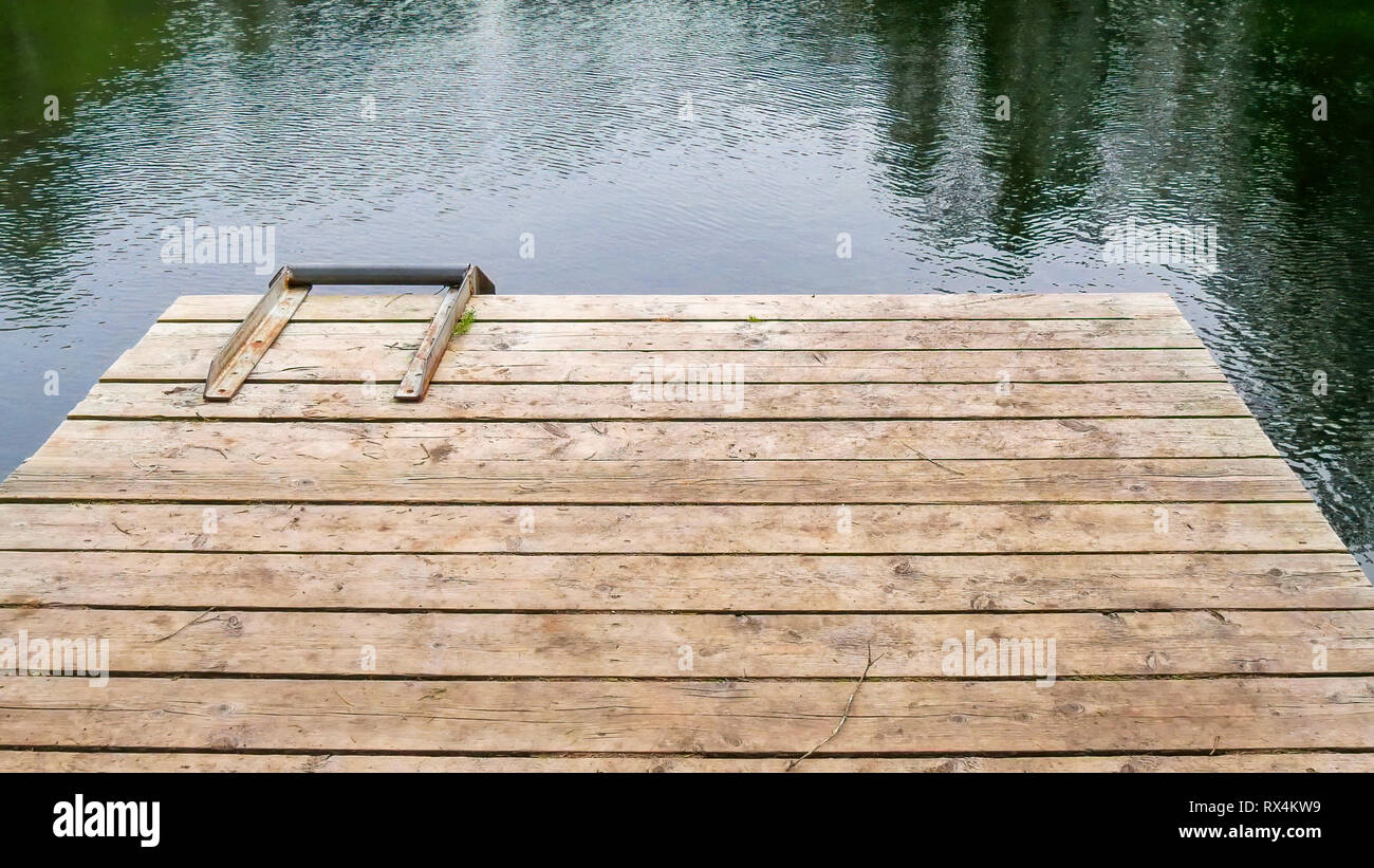 Diving ledge on the water spring where people jumps off to swim on the ...