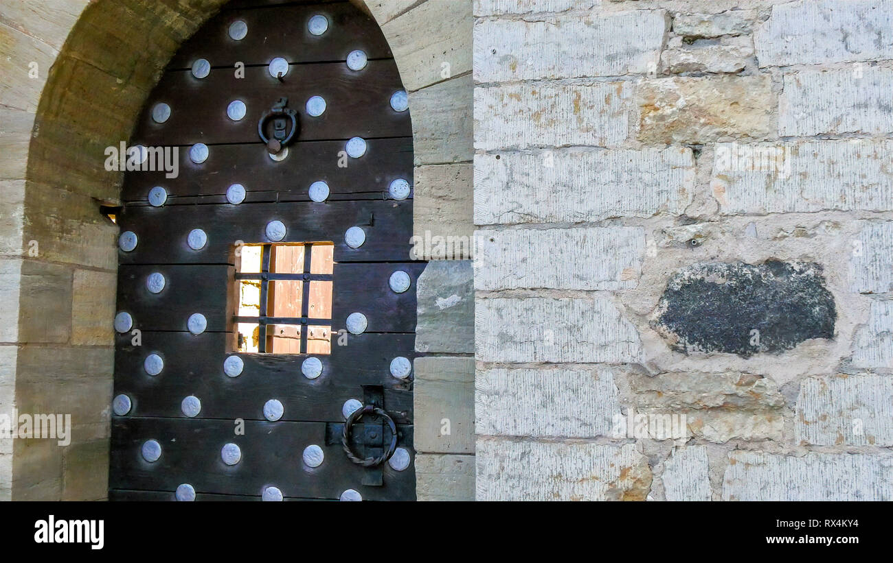 Walking through the big and small gates of the old medieval castle. The ...