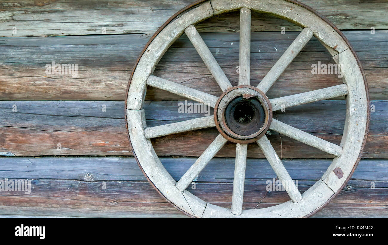 The round wheel hanging on the wall of the house. It serves as the ...