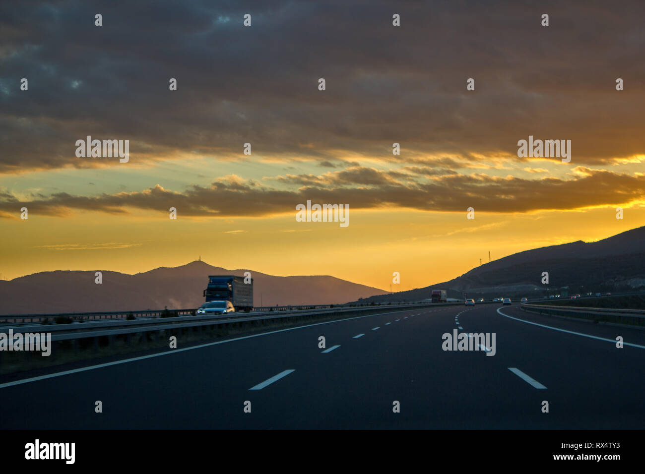 Sunset on the highway motorway Stock Photo - Alamy