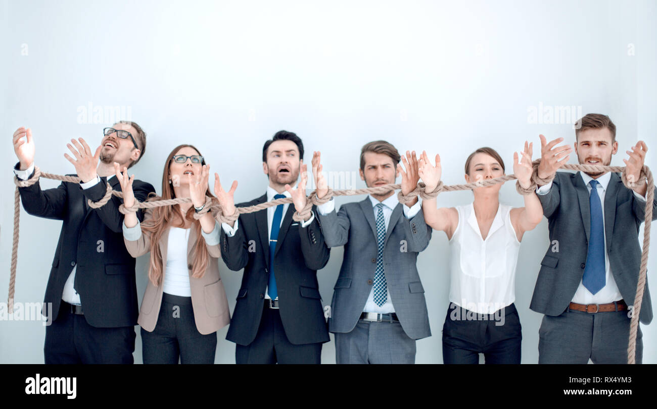 scared group of business people tied with a rope Stock Photo - Alamy