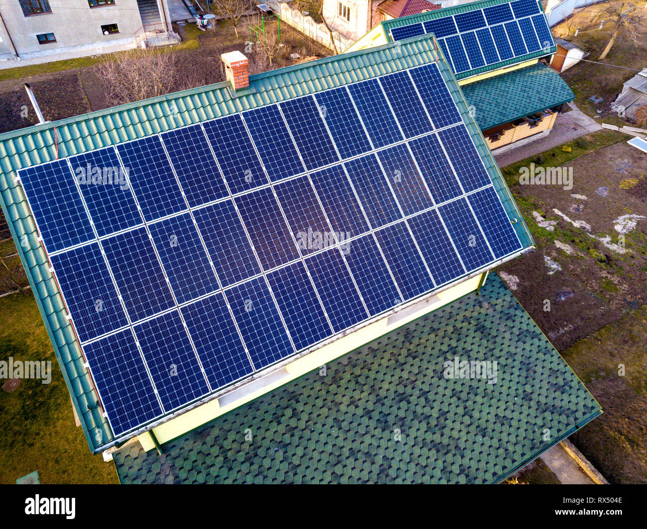 Aerial top view of new modern residential house cottage with blue shiny ...