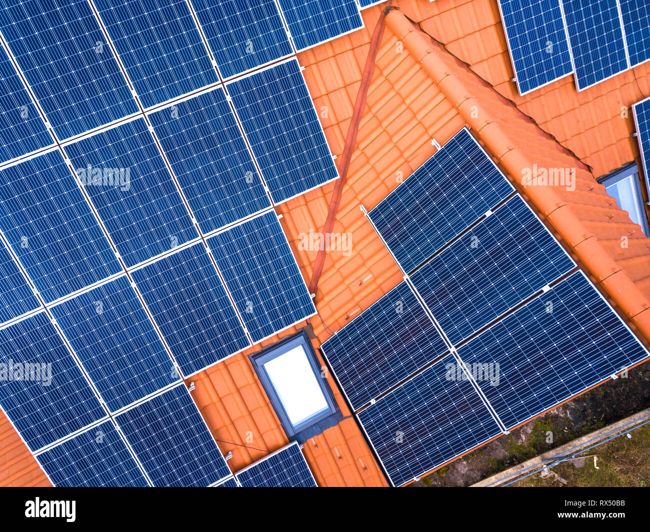 Aerial top view of new modern residential house cottage with blue shiny ...