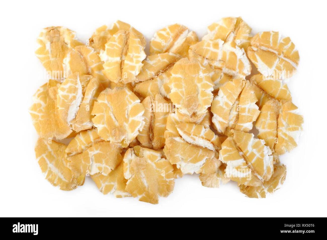 rolled wheat on white background Stock Photo - Alamy