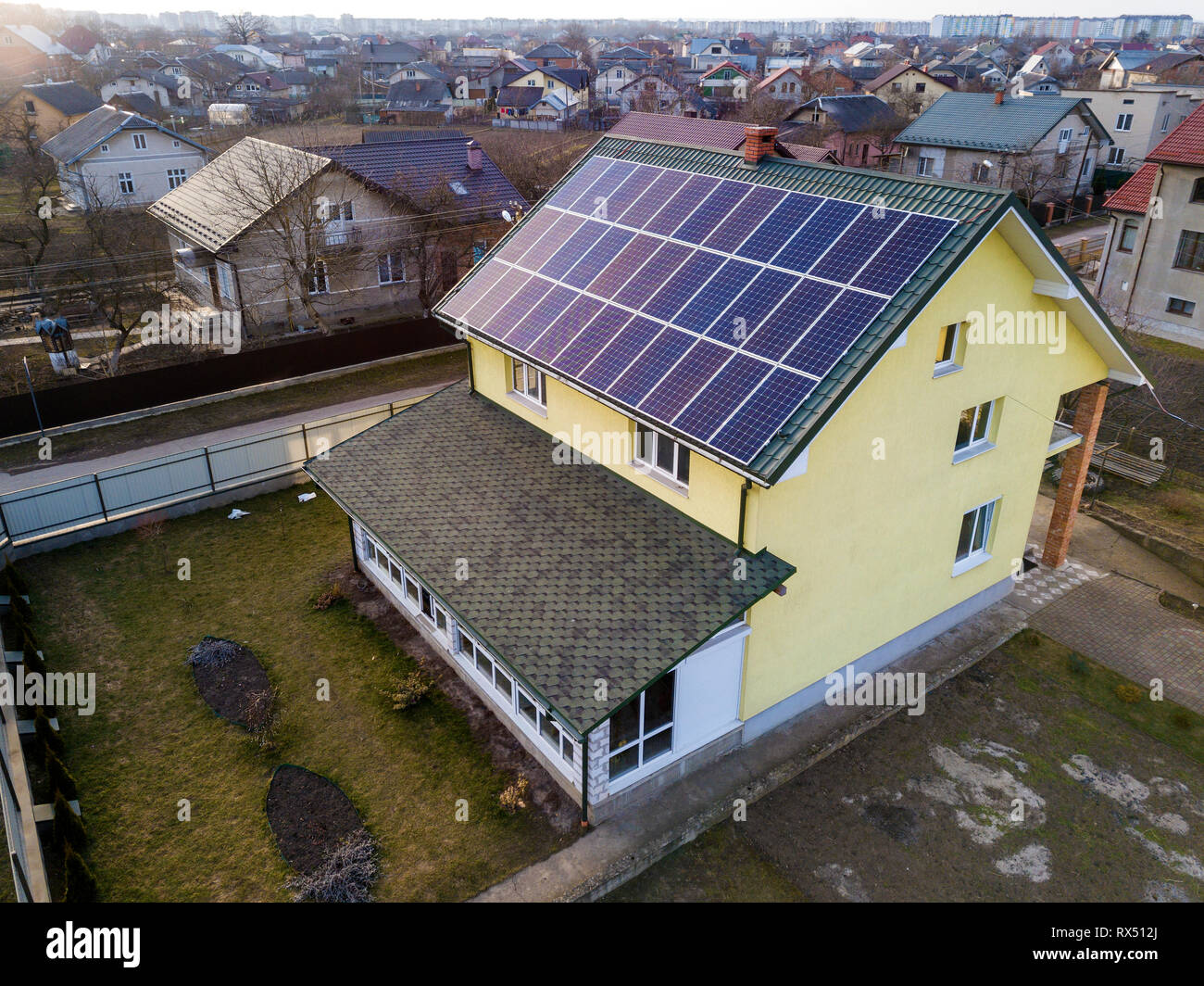 Aerial top view of new modern residential house cottage with blue shiny ...