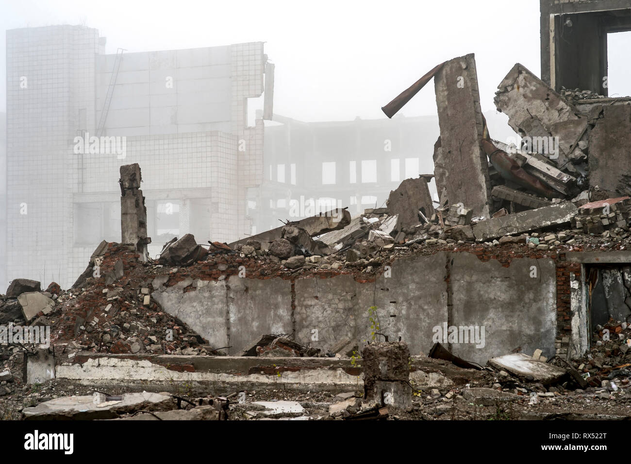 The remains of the destroyed building in the form of piles and a ...