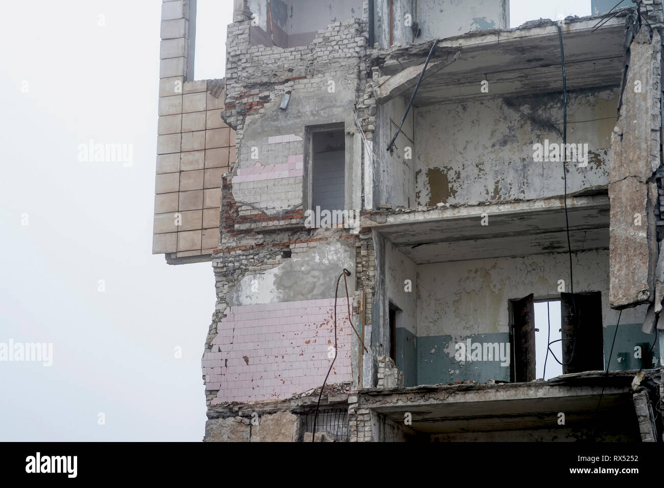 The remains of the frame of a large concrete building close-up. The ...