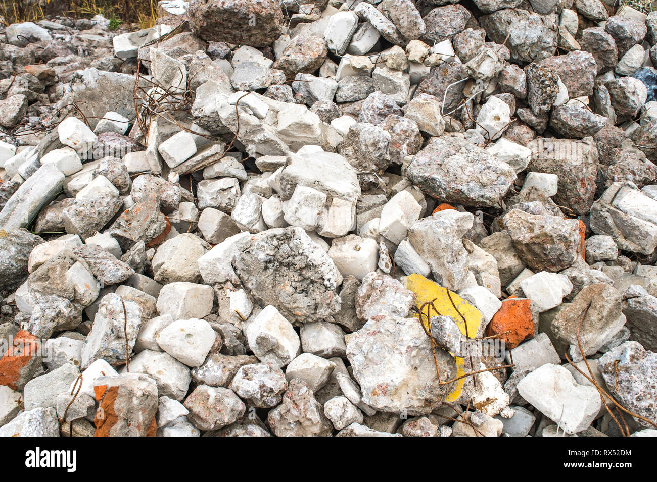 A pile of broken concrete structure from the wreckage of gray stones ...