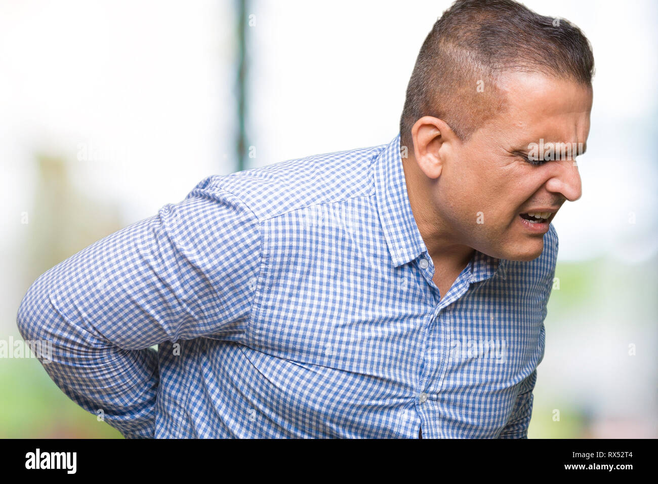 Middle age arab business man over isolated background Suffering of ...