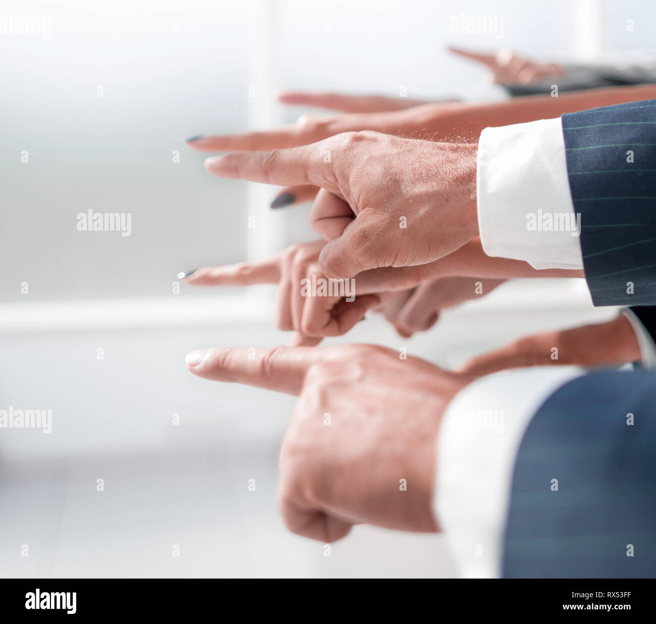 close up.business team pointing to the side Stock Photo - Alamy