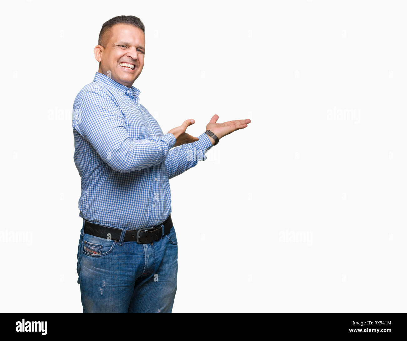 Middle age arab business man over isolated background Inviting to enter ...