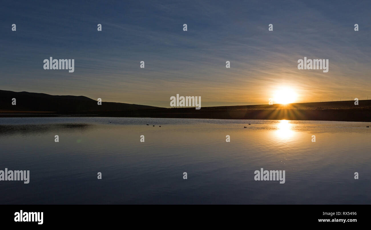 Sunset in Andes. lagoon Huayacota. High Andean landscape in the Andes ...