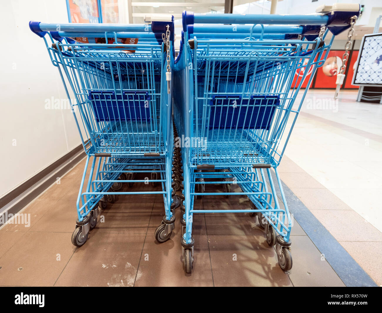 blue shopping carts wait outside supermarket for customers Stock Photo ...