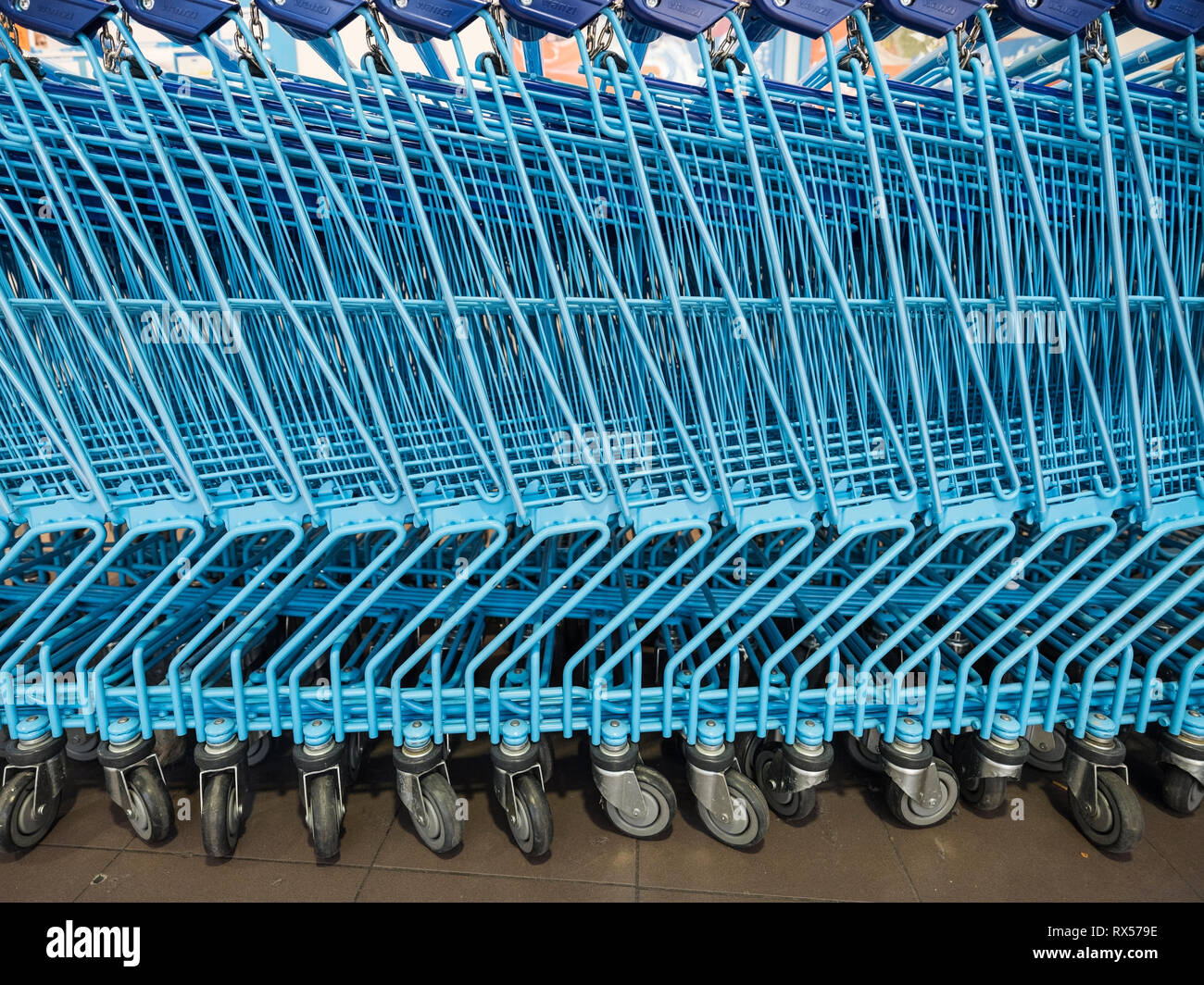 blue shopping carts wait outside supermarket for customers Stock Photo ...