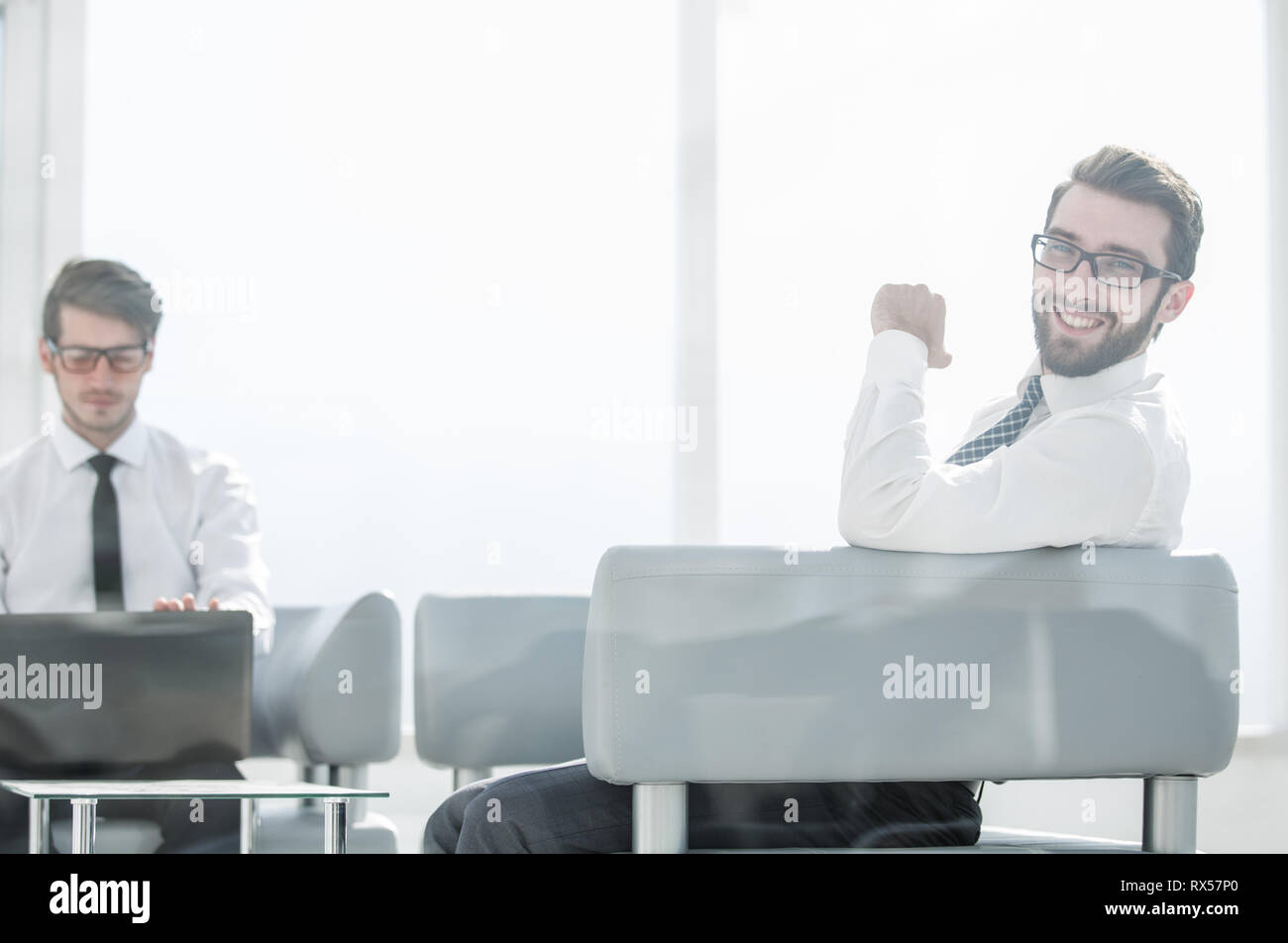 business background.employees sitting in the office lobby Stock Photo ...