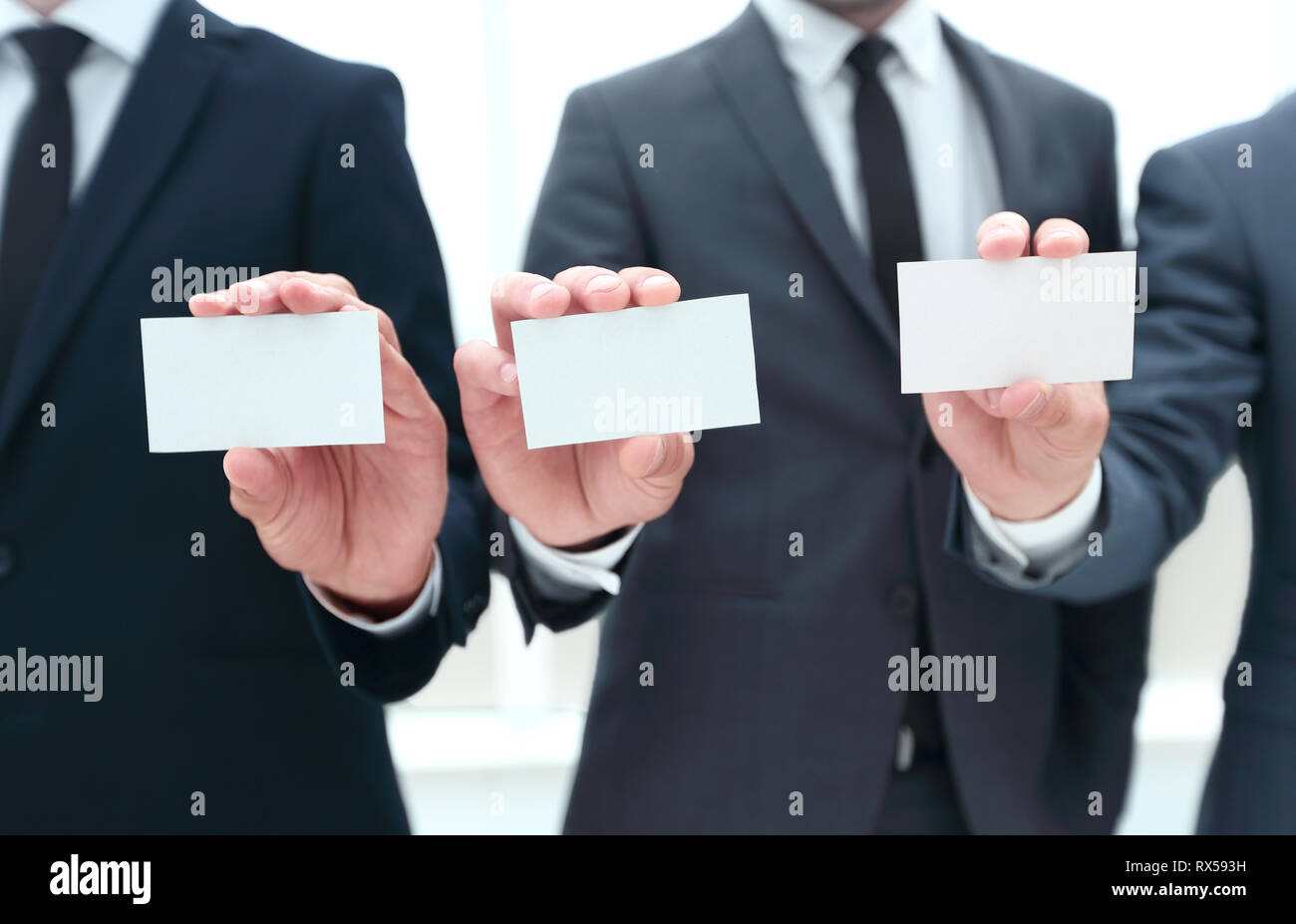 three business partners showing their business card form Stock Photo ...