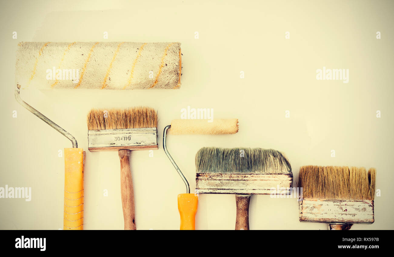 Wall paint brushes and imstruments for painting on the white background ...