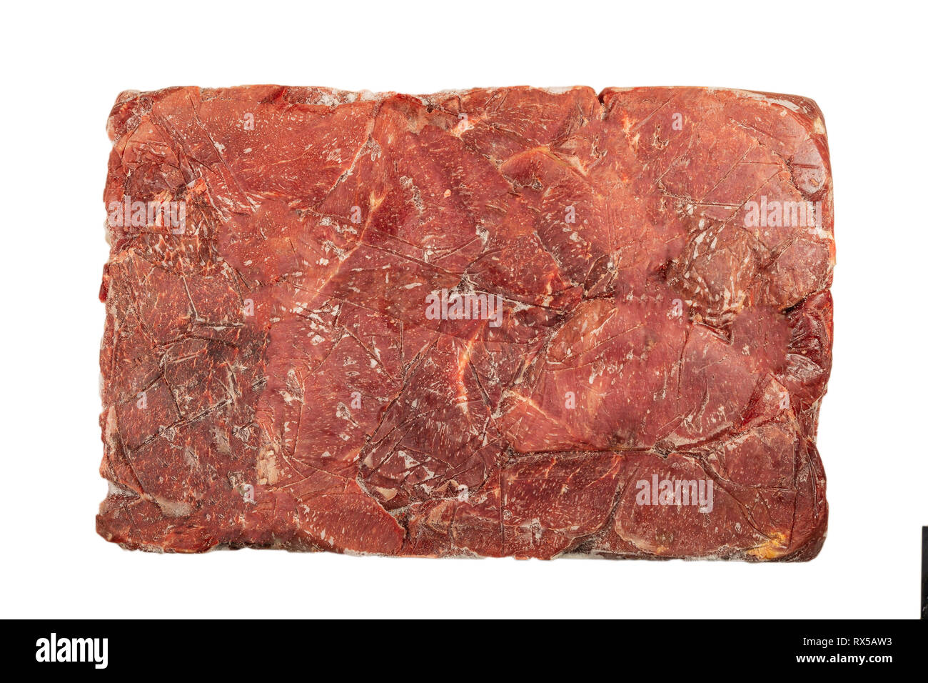 Frozen block of beef on a white background Stock Photo - Alamy