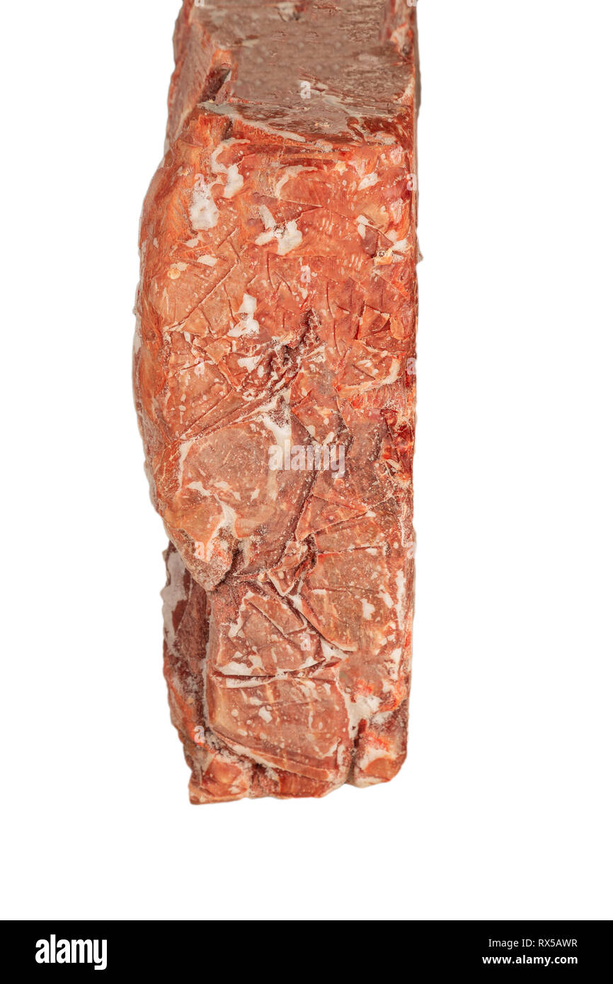 Frozen block of beef on a white background Stock Photo - Alamy