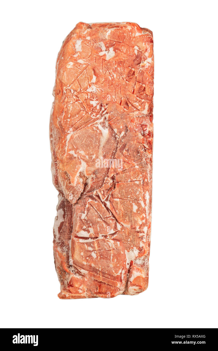 Frozen block of beef on a white background Stock Photo - Alamy