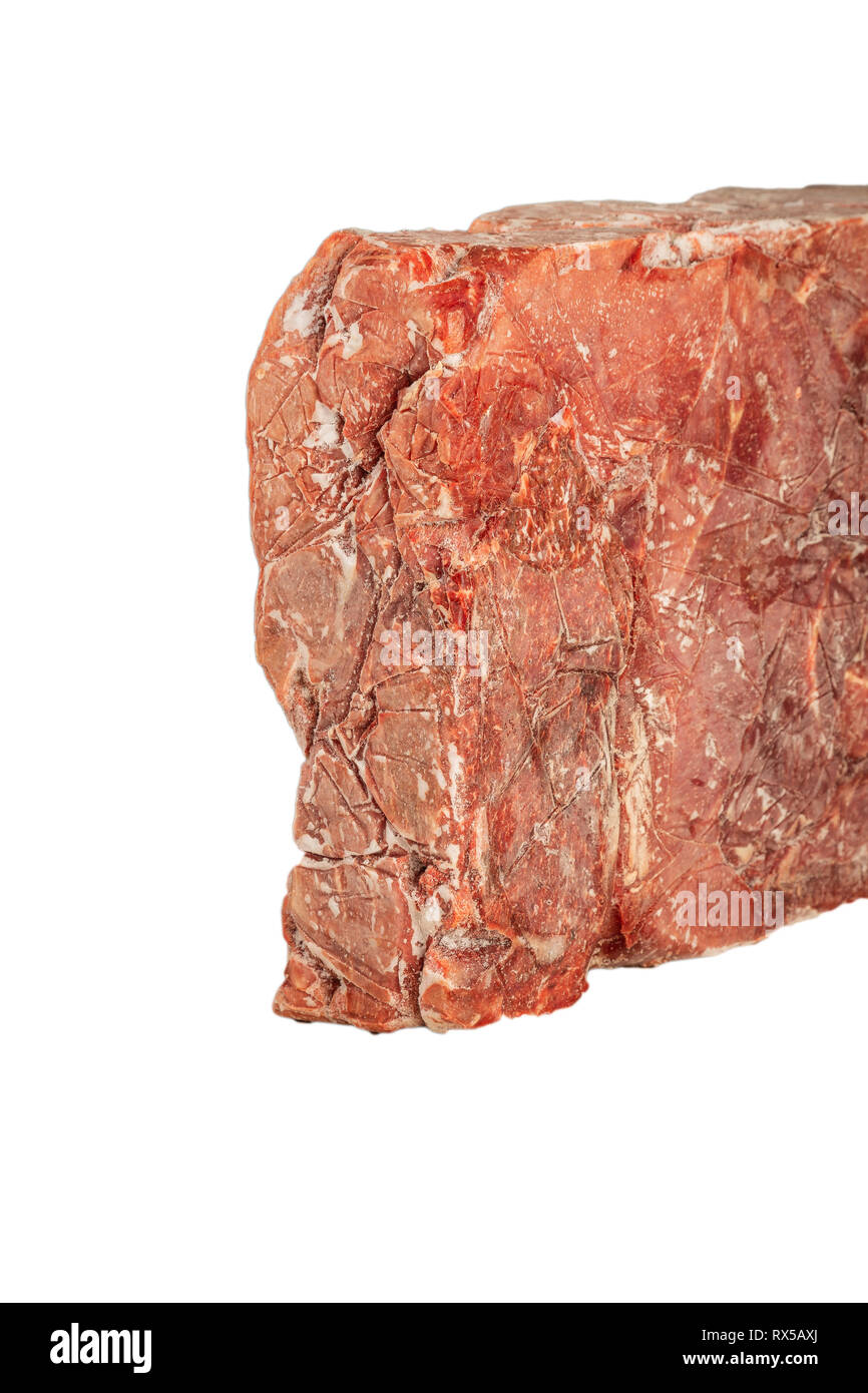 Frozen block of beef on a white background Stock Photo - Alamy