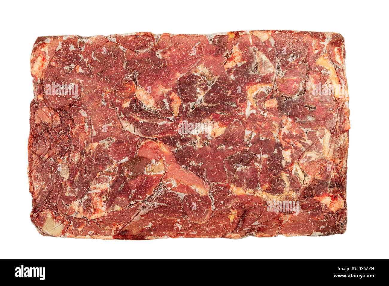 Frozen block of beef on a white background Stock Photo - Alamy