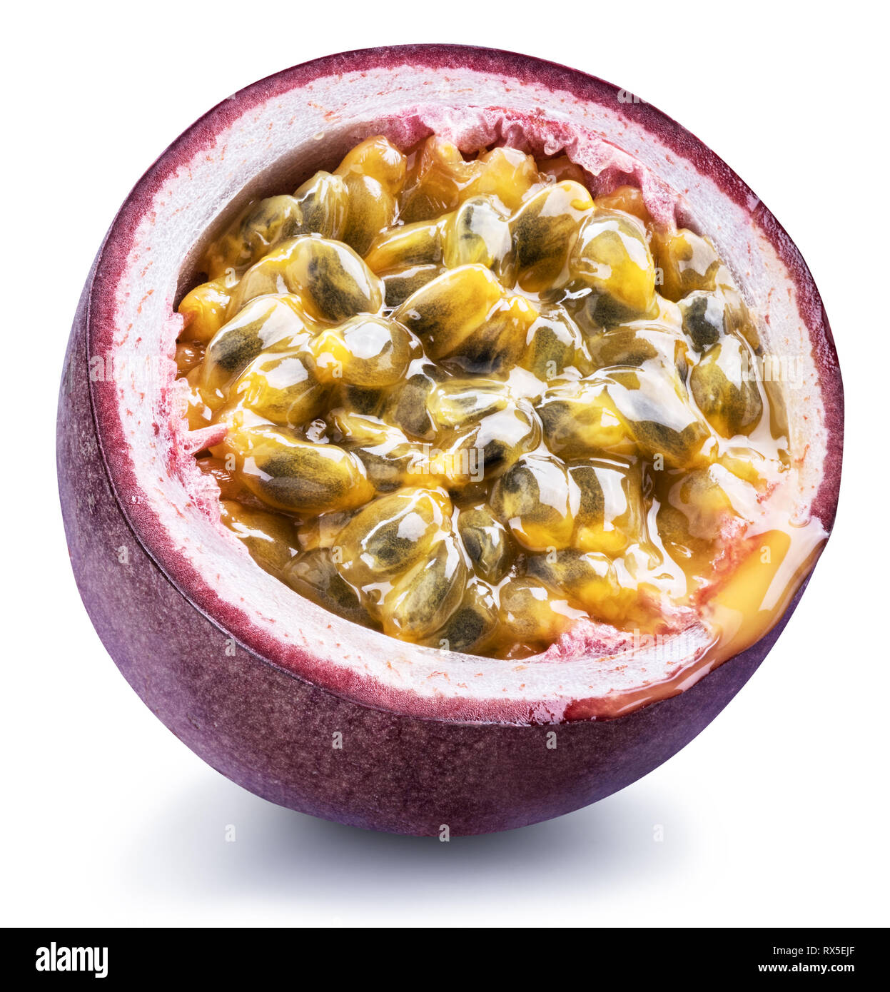 Passion fruit cross section with pulpy juice filled with seeds ...