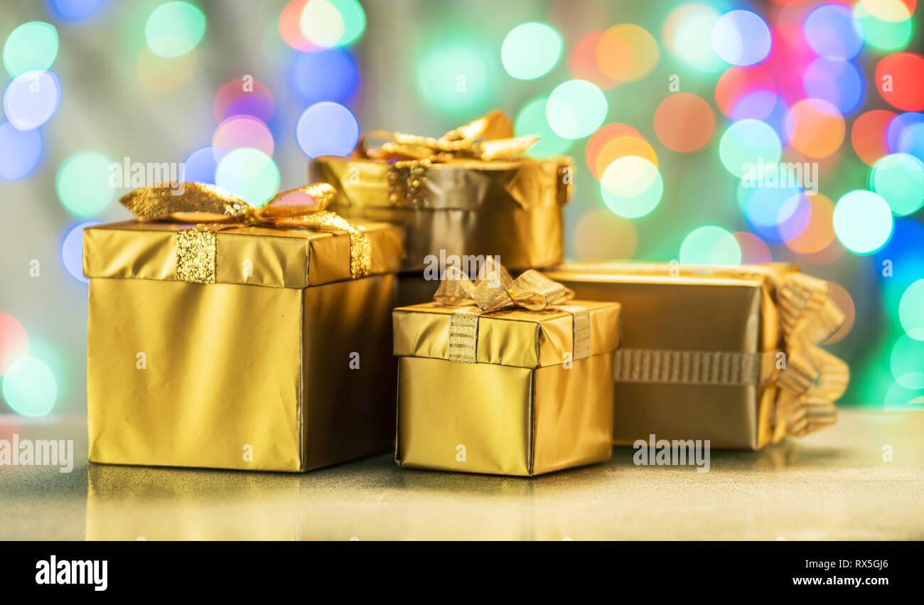 Golden gift boxes as a symbol of wishes and celebration. Colorful ...