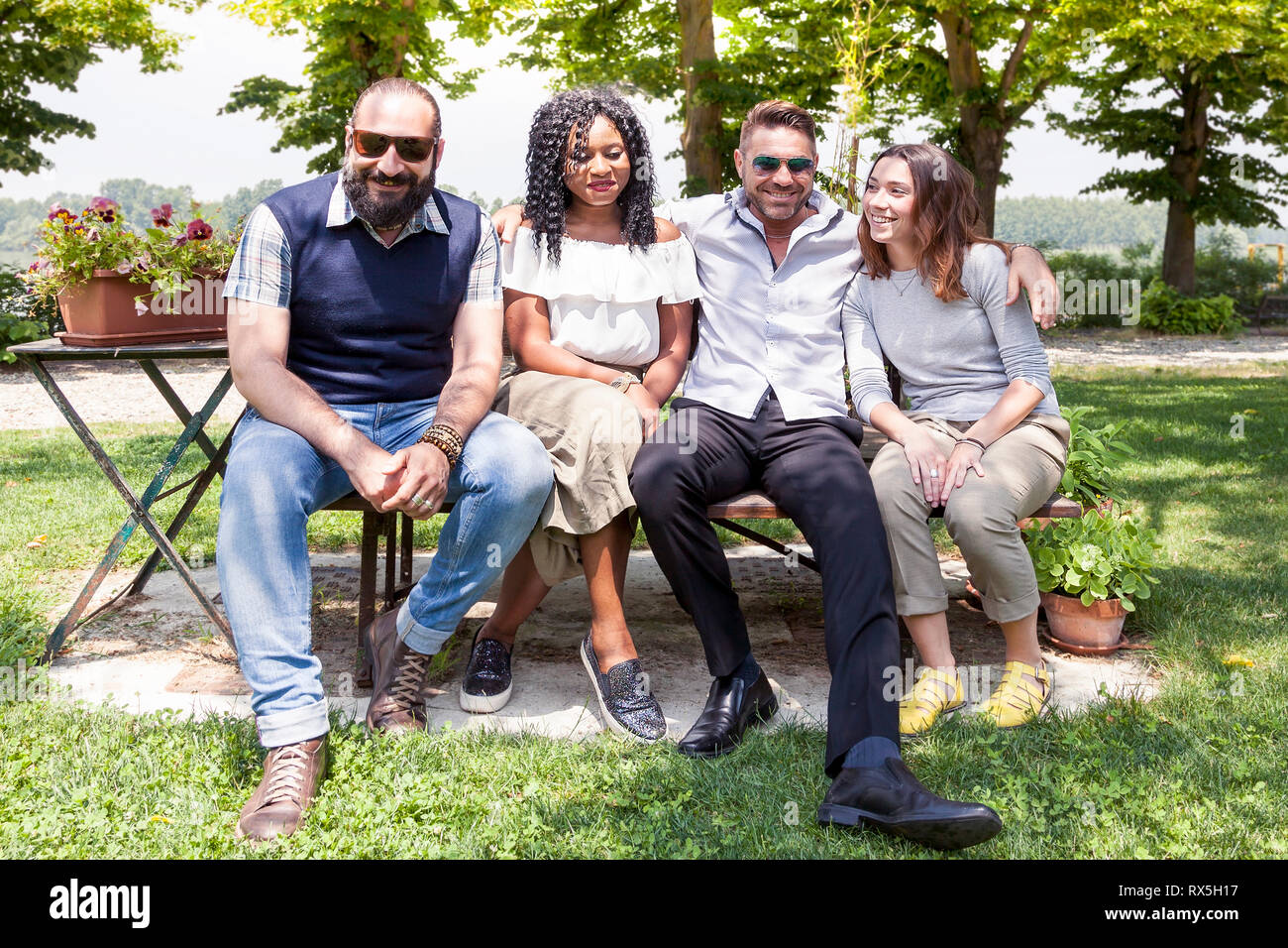 Young friends embracing outdoor party hi-res stock photography and ...