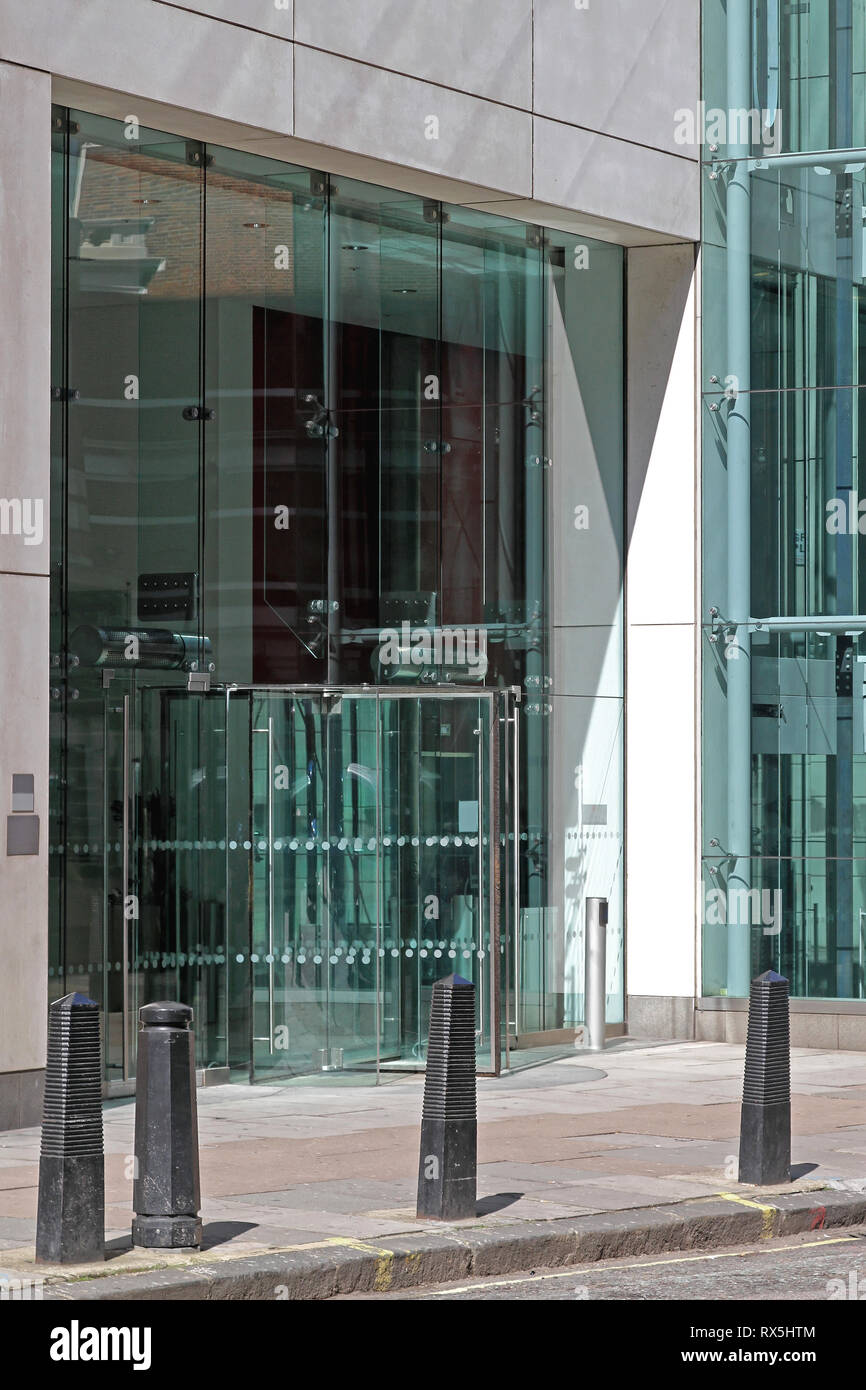 Green Glass Revolving Doors Office Building Entrance Stock Photo - Alamy