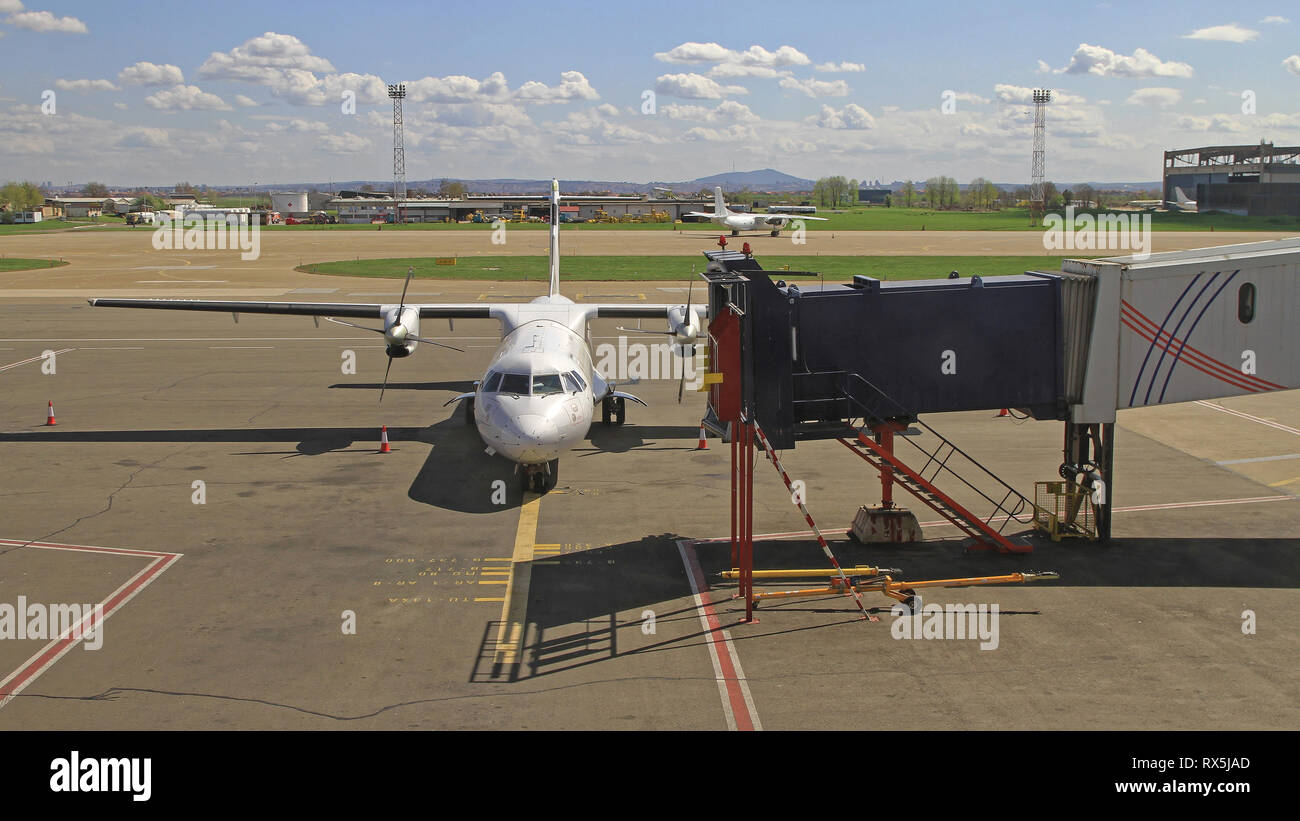 Turbo Propeller Airplane Dock at Airport Stock Photo - Alamy