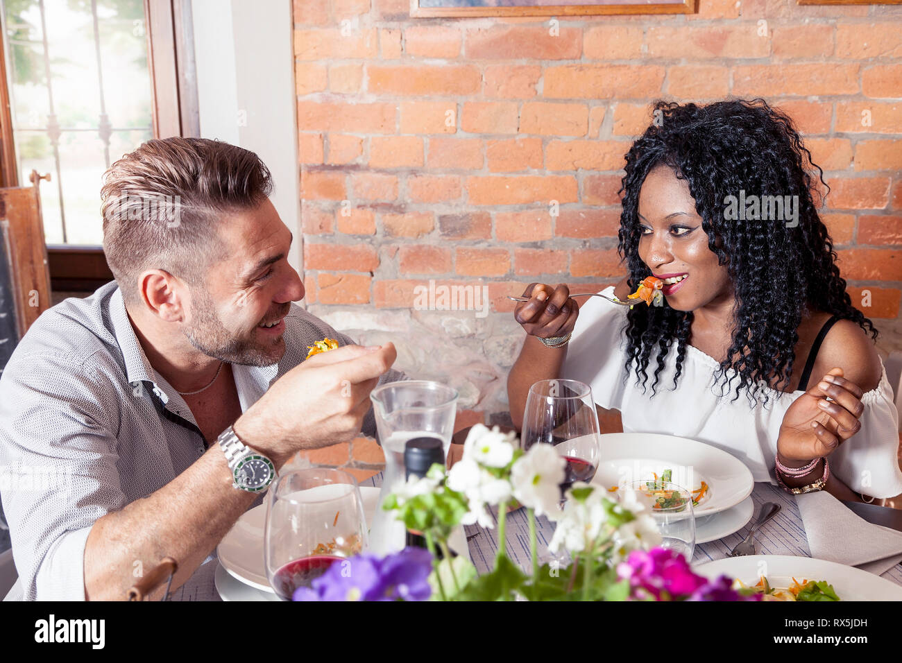 romantic young couple dining at a nice restaurant Stock Photo - Alamy