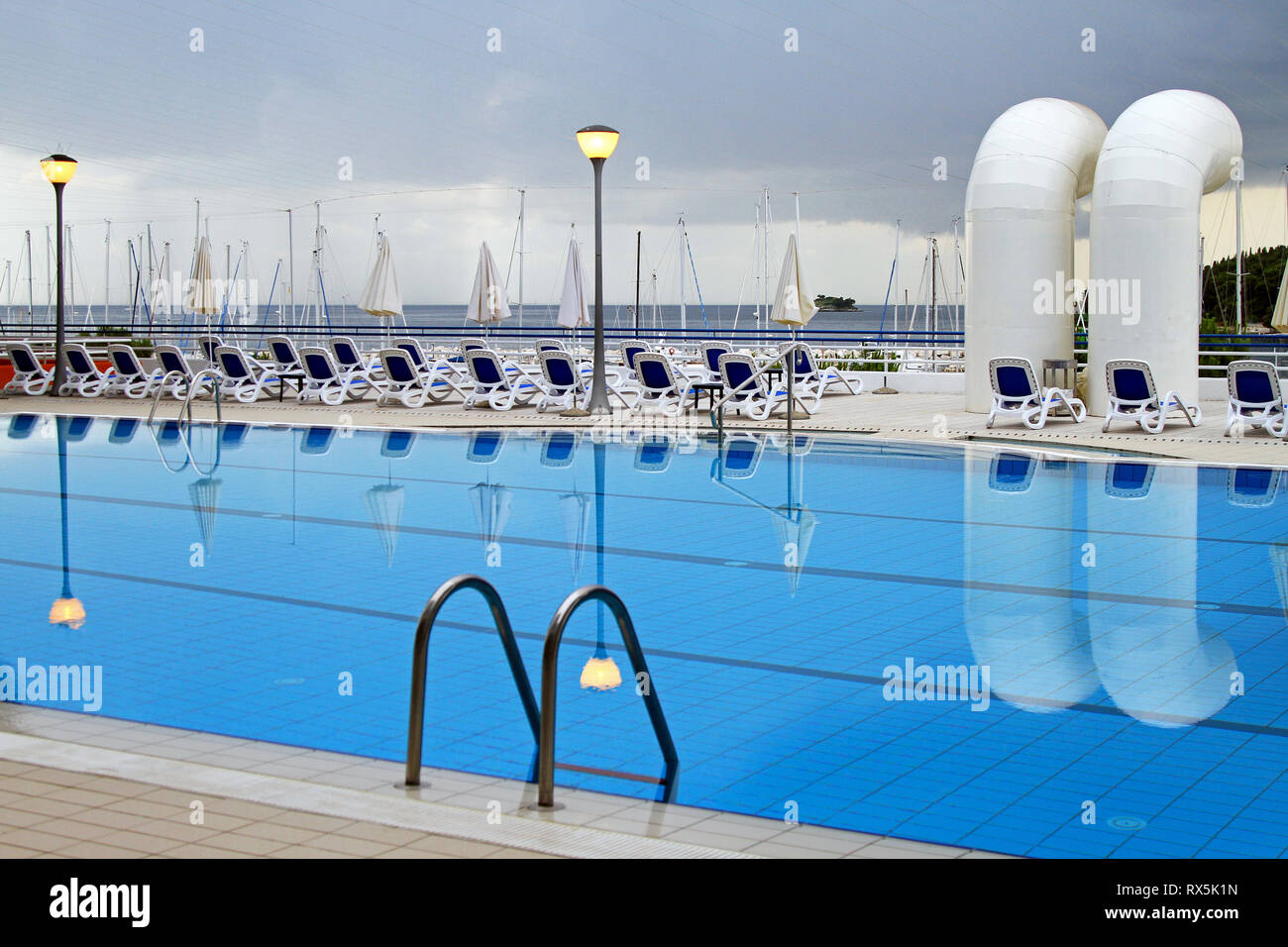 Outdoor swimming pool with calm blue water Stock Photo - Alamy