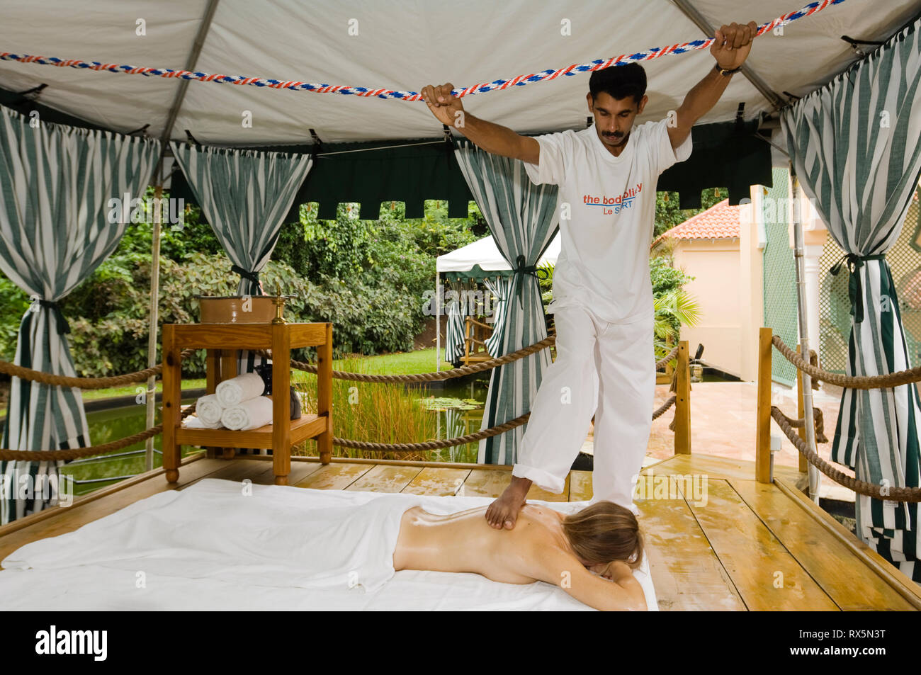 Woman receiving ashiatsu massage in tent Stock Photo - Alamy