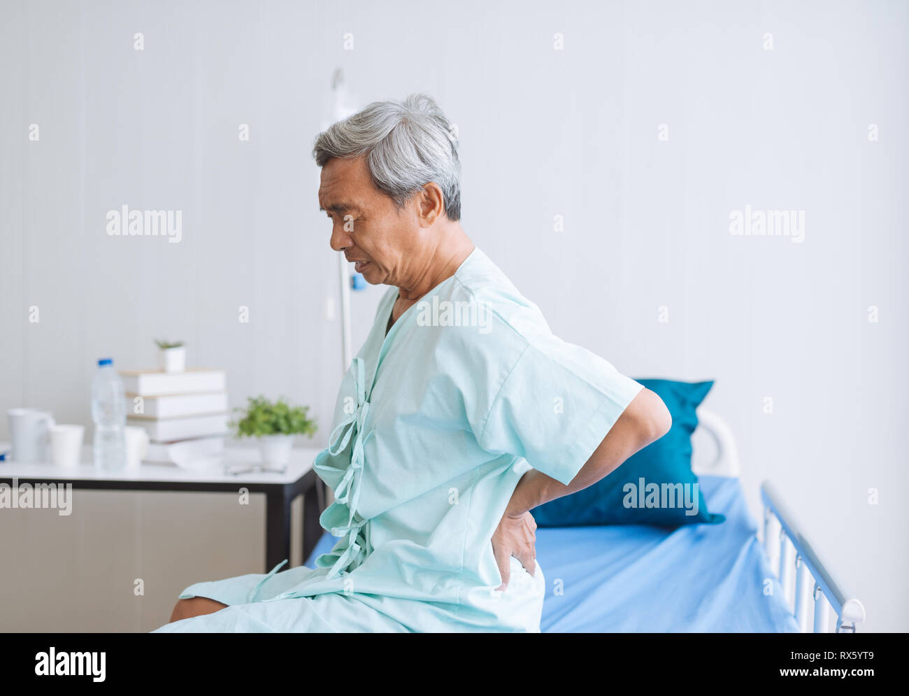 Asian senior man patient pain and backache rest in hospital Stock Photo ...
