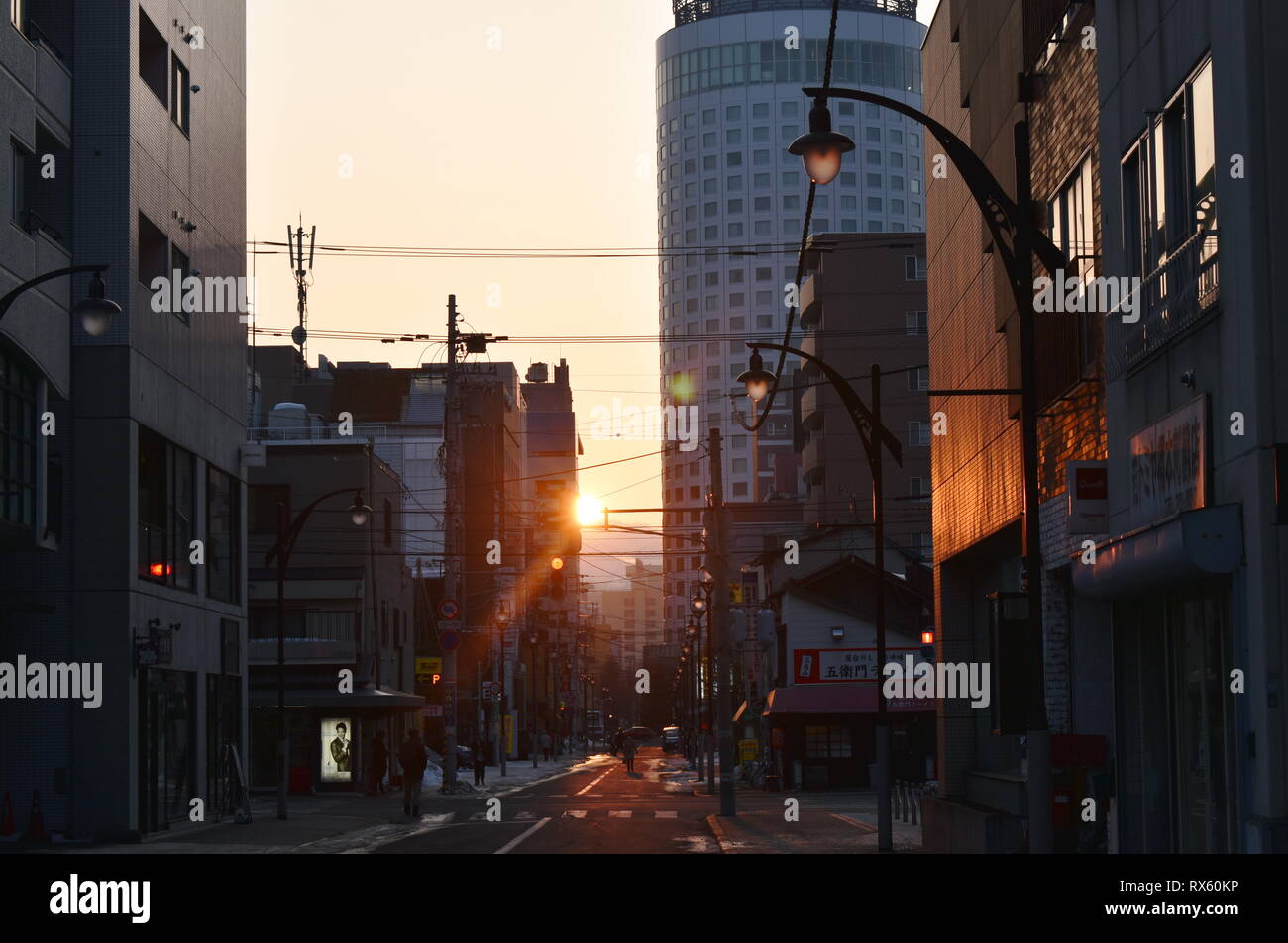 Hokkaido Japan March, 5 2019 : sunset behind building at Tanukikoji ...
