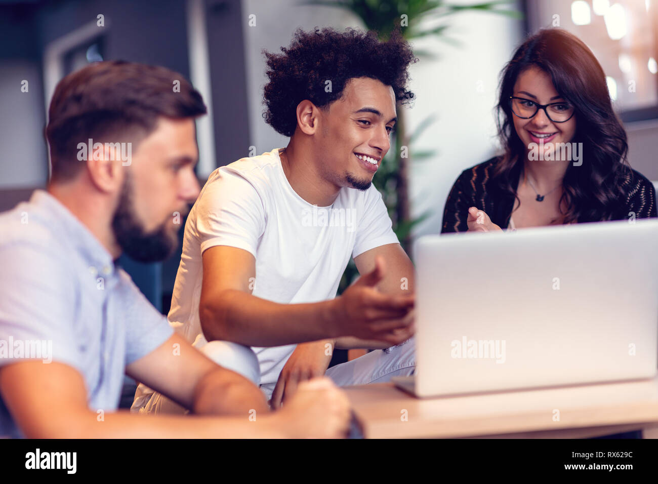 Teamwork concept.Young creative coworkers working with new startup project in modern office ...