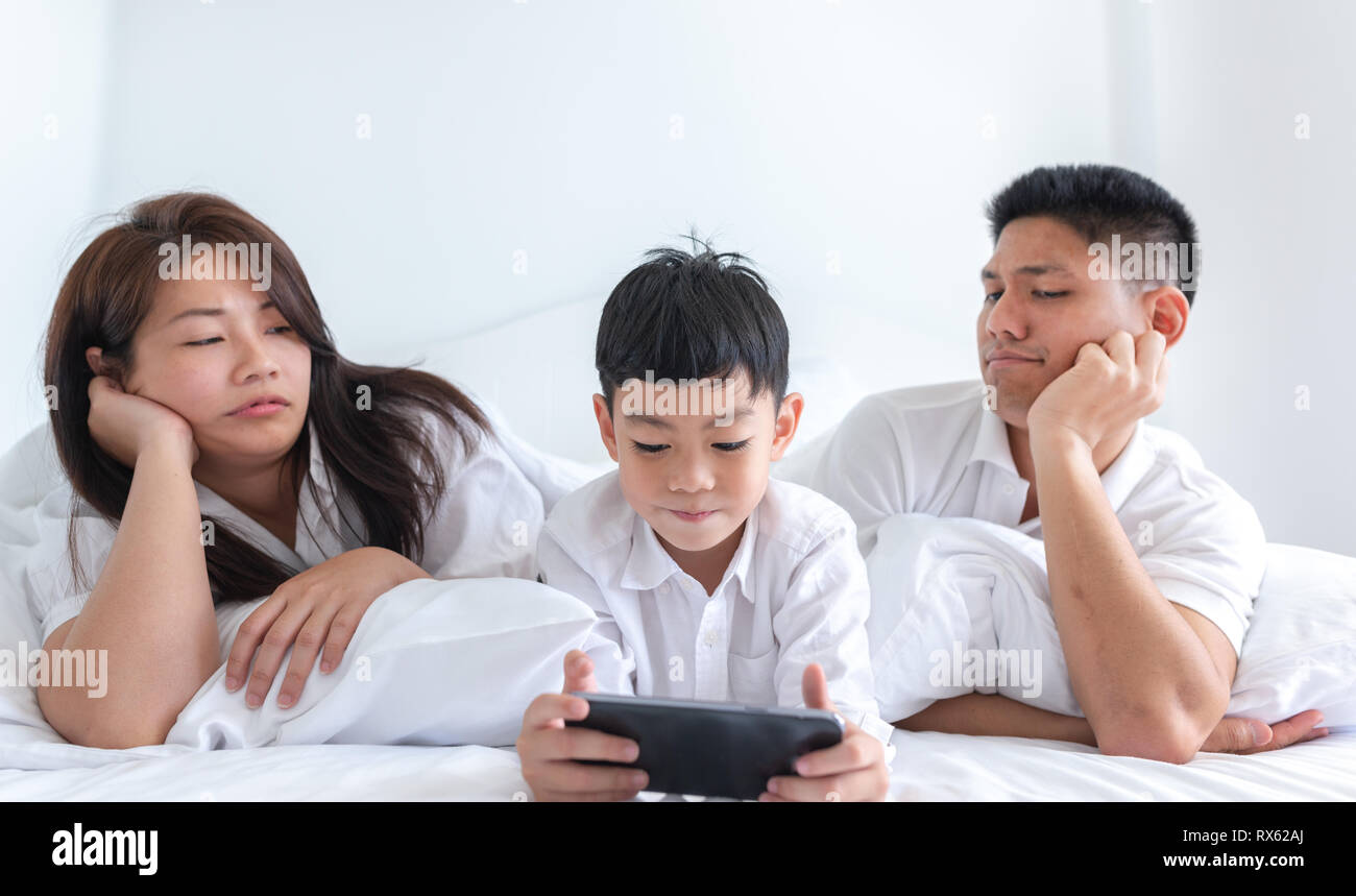 kid addict phone parent unhappy Stock Photo - Alamy