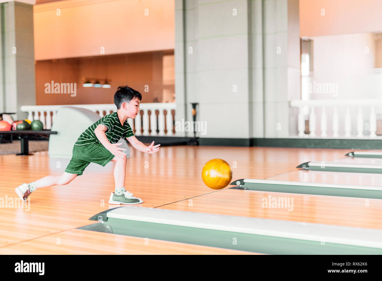 Kid bowling ball pins rolling hi-res stock photography and images - Alamy