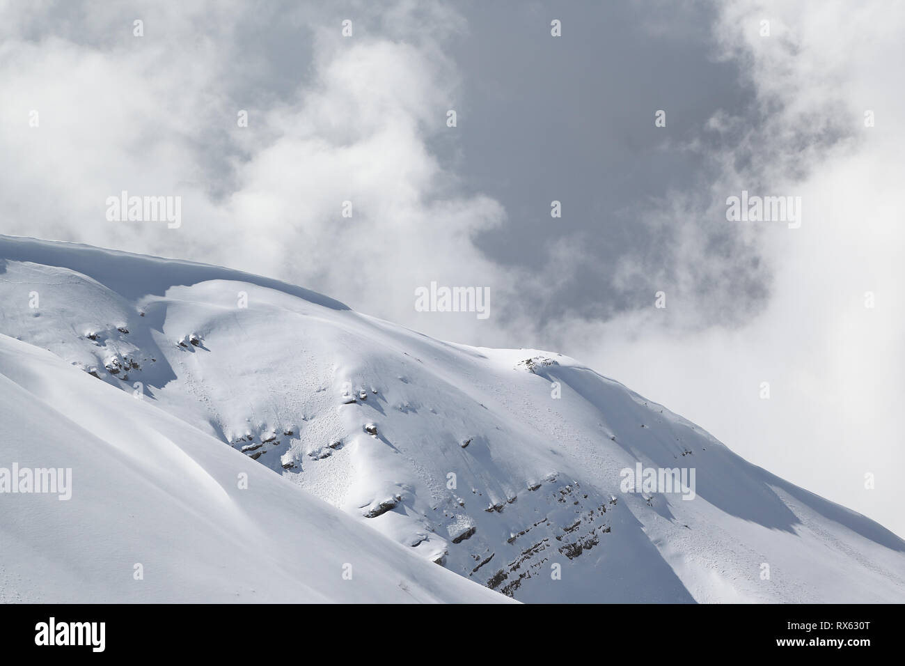Mountains Snow and Clouds Stock Photo - Alamy