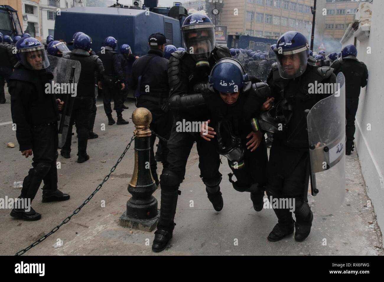Algiers, Algeria. 08th Mar, 2019. An injured Algerian riot police man ...