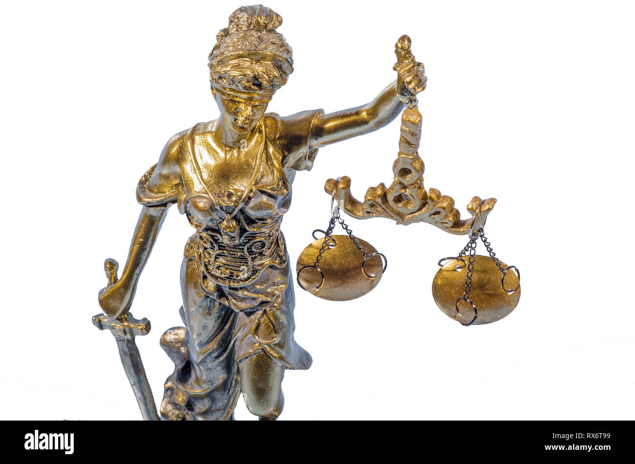 photo of golden statue of Justice isolated on white background Stock ...
