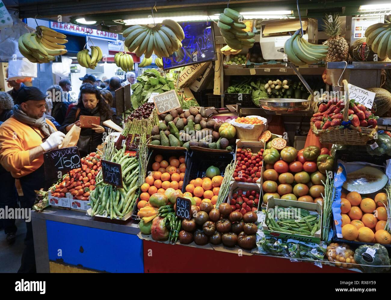 Fresh spanish fruits and vegetables are offered at a market in Malaga ...