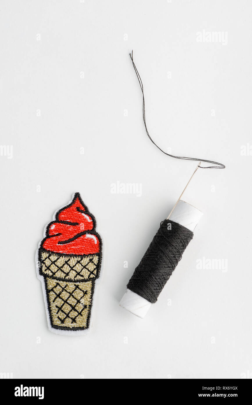Needle and thread and fabric patch hi-res stock photography and images ...